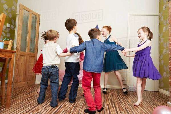 Children dancing at birthday party - Stock Photo - Dissolve