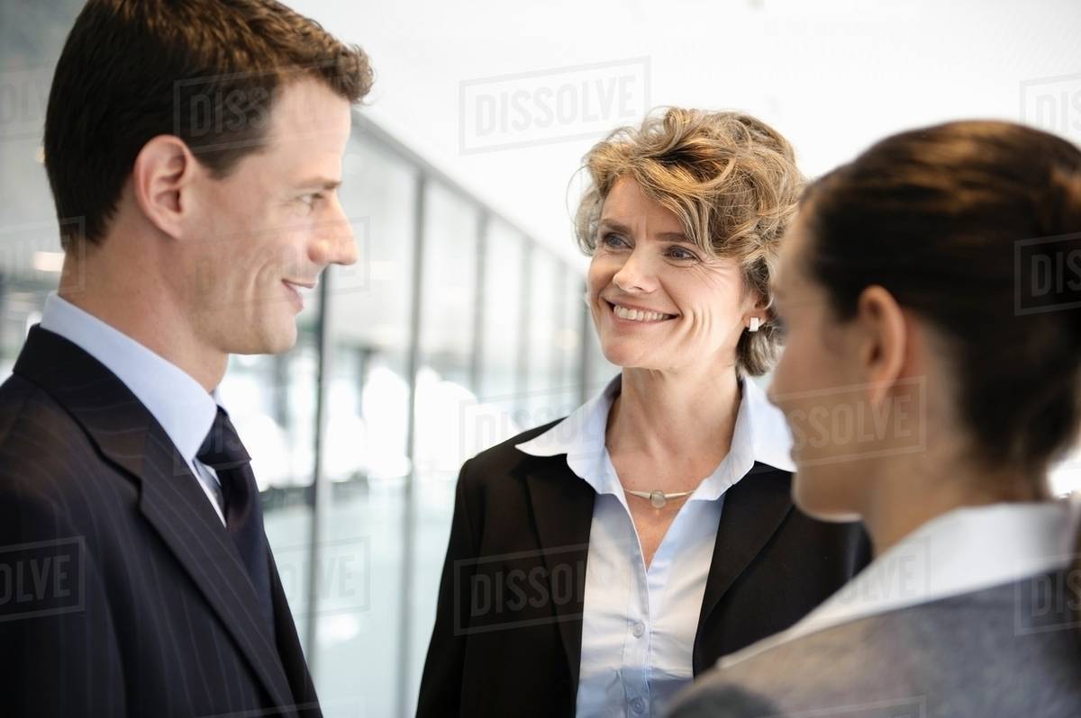 Business people having a conversation - Stock Photo - Dissolve