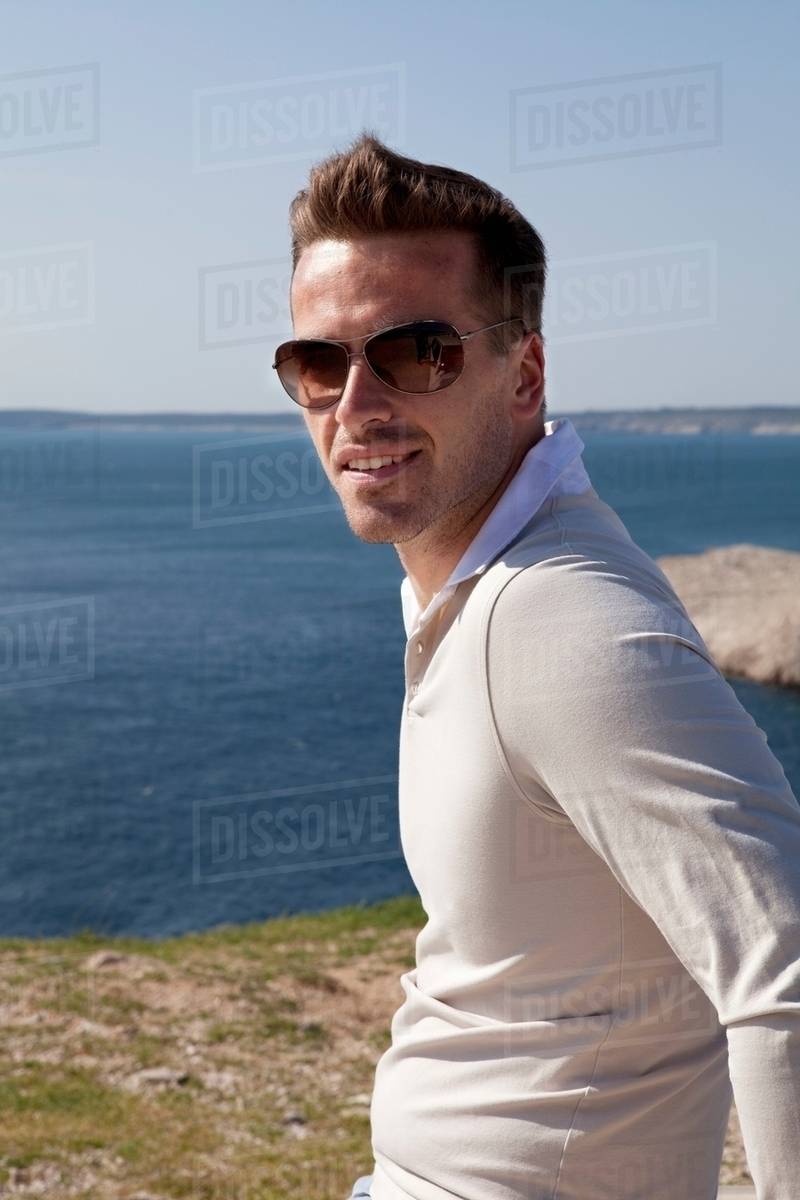 Man overlooking sea - Royalty-free Stock Photo | Dissolve