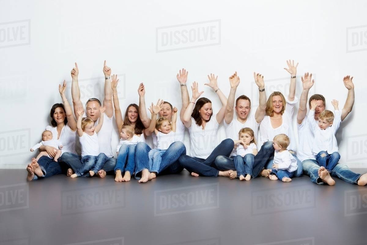 Parents and children cheering together - Stock Photo - Dissolve