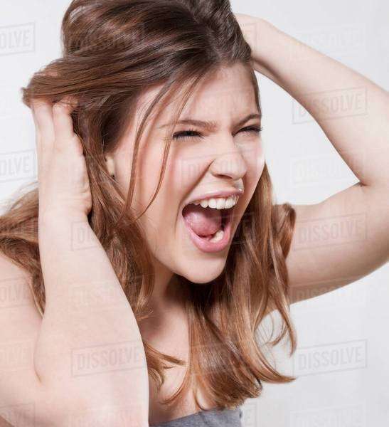 Close up of woman screaming - Royalty-free Stock Photo | Dissolve