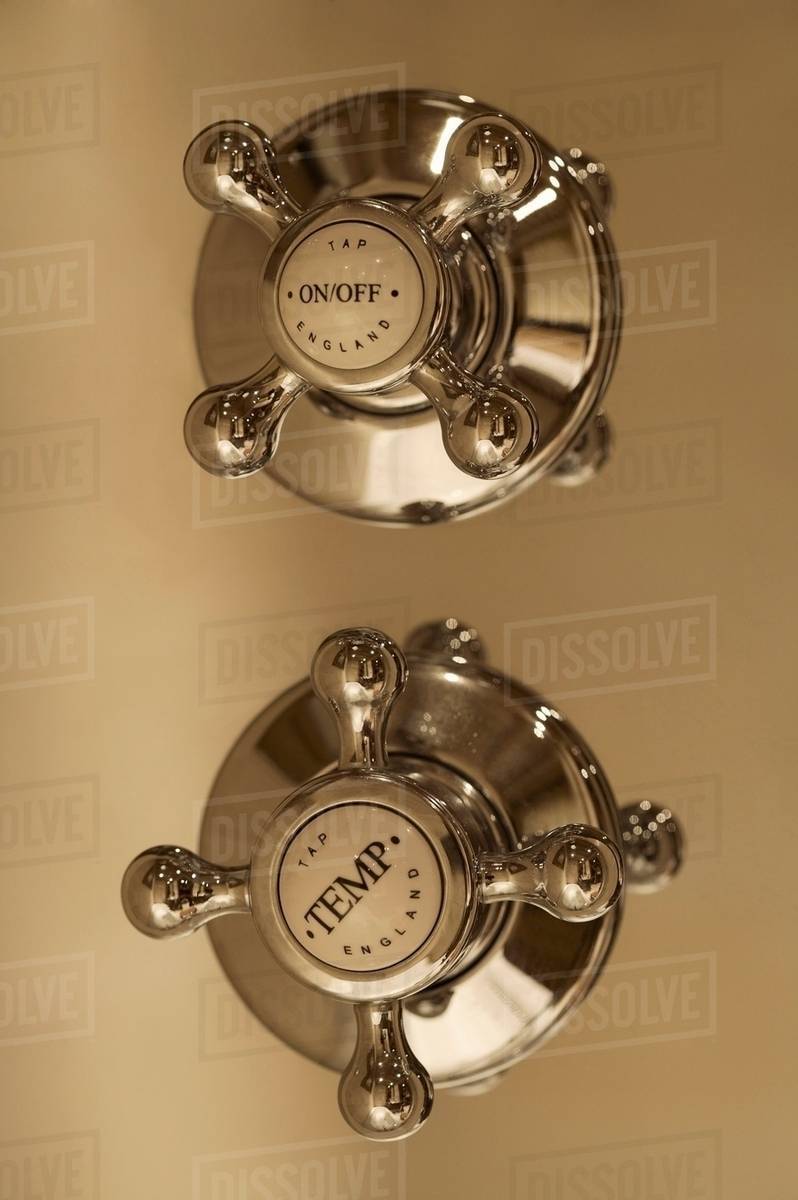 Close up of shower faucet handles - Stock Photo - Dissolve