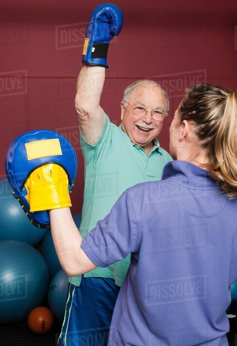 Older man boxing in gym - Royalty-free Stock Photo | Dissolve