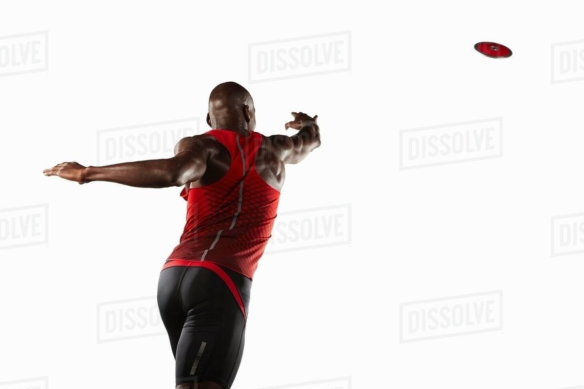 Athlete throwing discus - Royalty-free Stock Photo | Dissolve