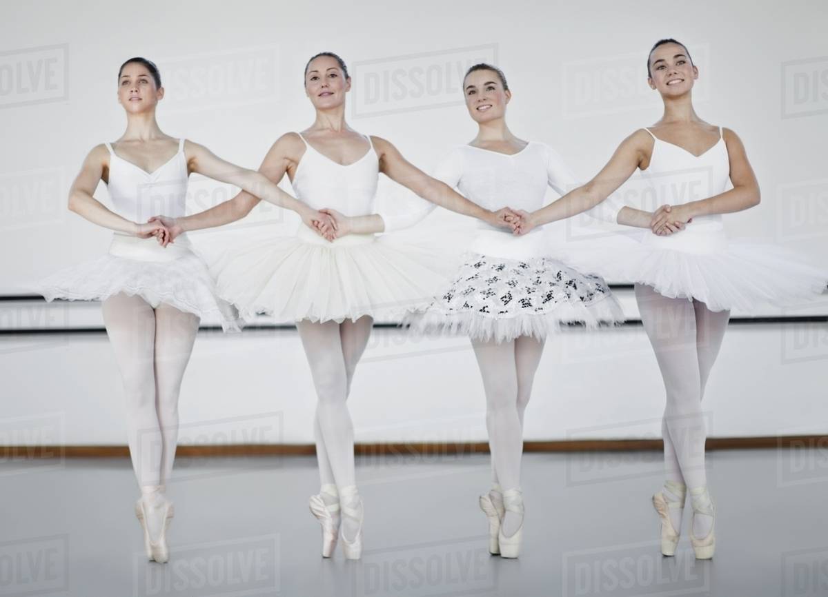 Ballet dancers holding hands in studio - Royalty-free Stock Photo ...