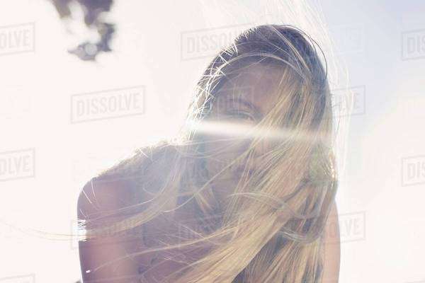 Woman's hair covering her face - Royalty-free Stock Photo | Dissolve
