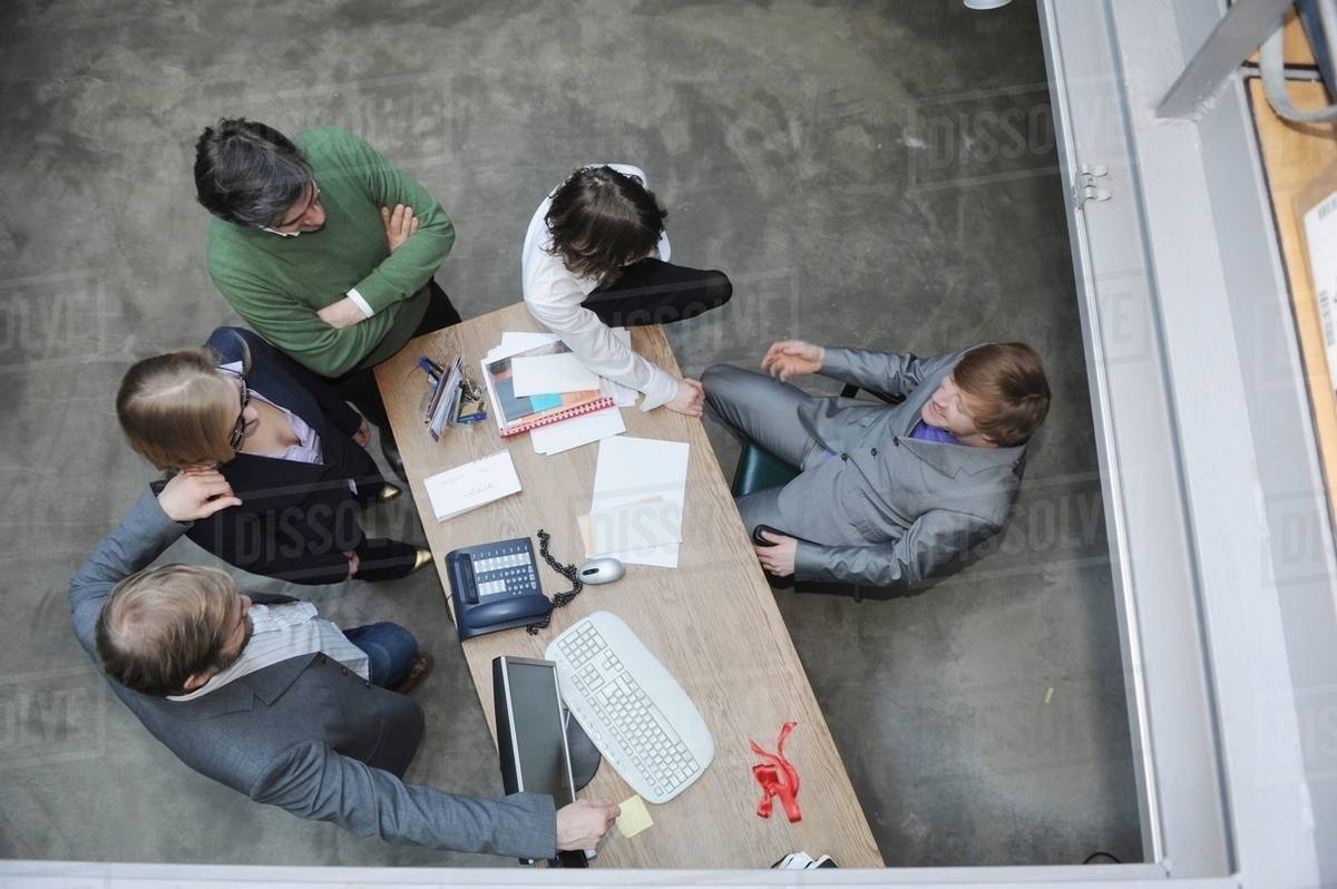 Overhead view of business people at desk - Royalty-free Stock Photo ...