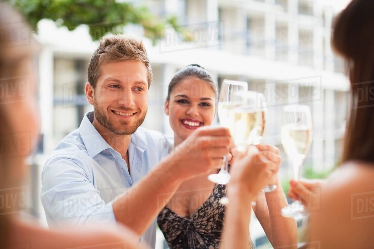Friends toasting each other - Royalty-free Stock Photo | Dissolve