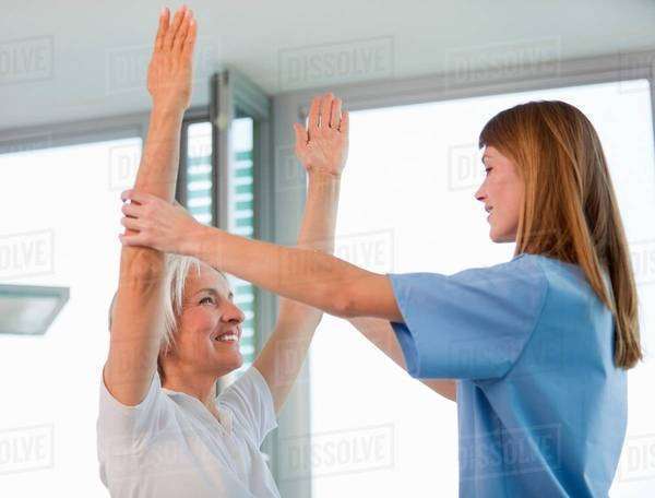 Doctor examining womans arms in office - Royalty-free Stock Photo ...