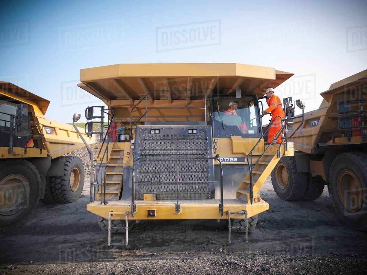 Dumper truck drivers in discussion in opencast coalmine - Stock Photo ...