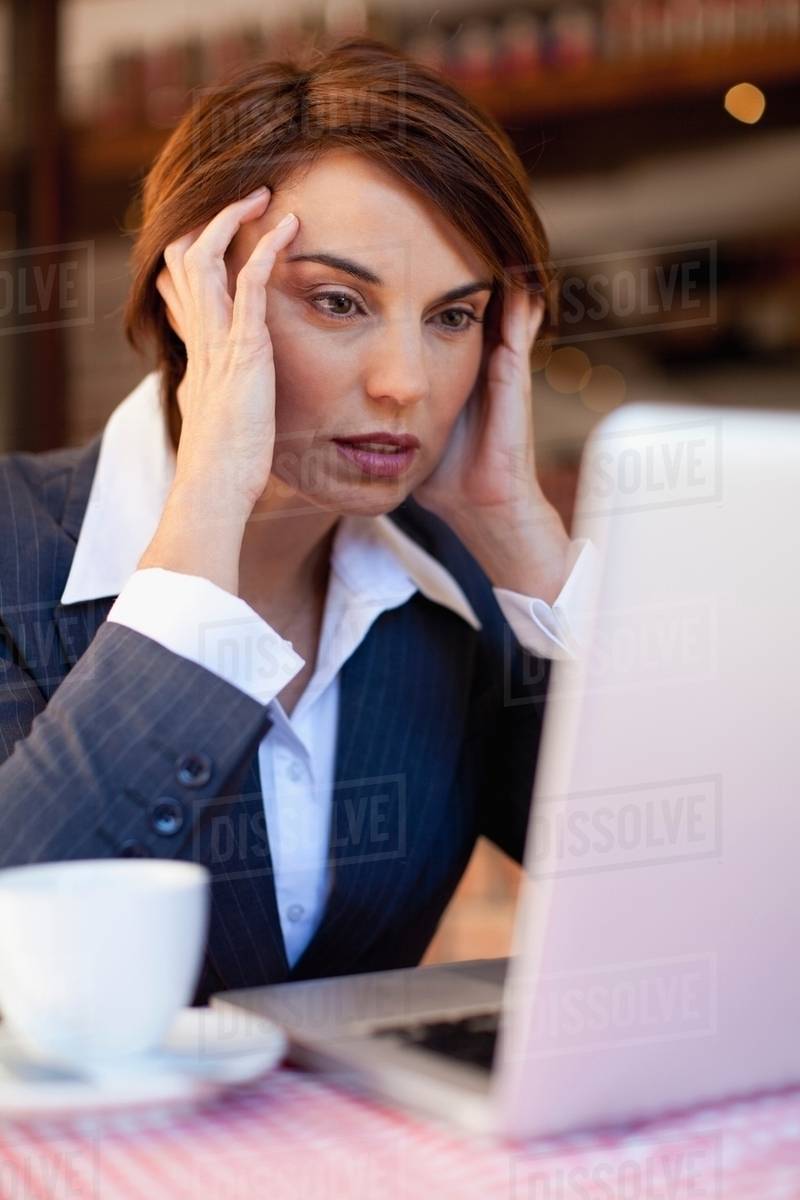 Stressed businesswoman working in cafe - Royalty-free Stock Photo ...