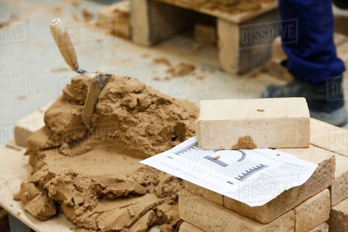 Cement, brick stack and blueprint on top of pallet - Royalty-free Stock ...