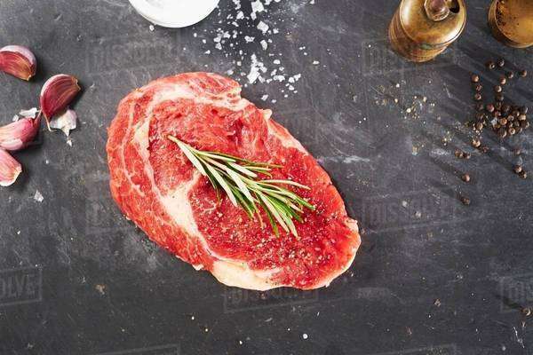 Sirloin steak, uncooked, close-up - Royalty-free Stock Photo | Dissolve