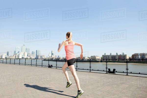 Runner jogging along waterfront, Wapping, London - Royalty-free Stock ...