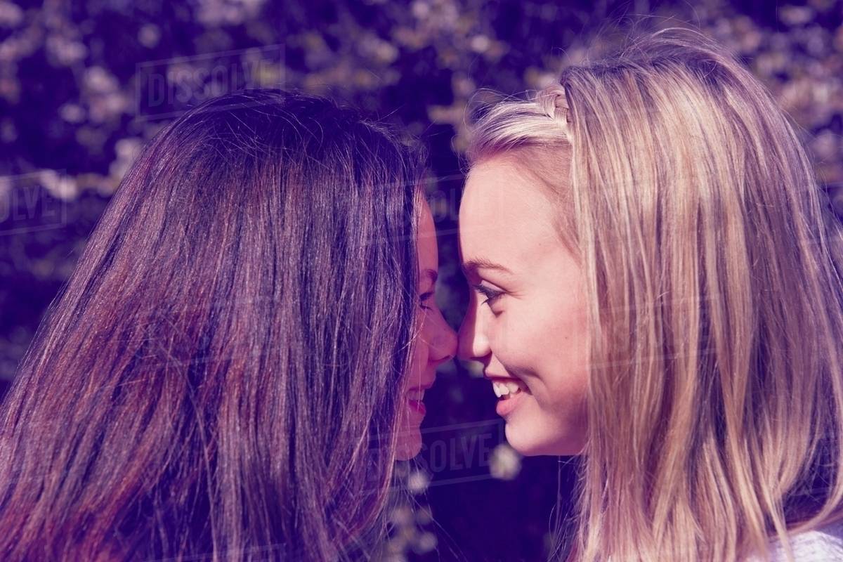 Close up portrait of two girls face to face - Royalty-free Stock Photo ...