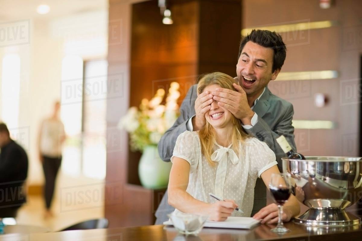 Couple having fun at bar - Royalty-free Stock Photo | Dissolve