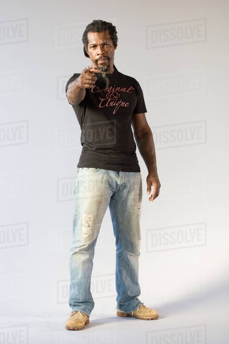 Man pointing at camera - Royalty-free Stock Photo | Dissolve