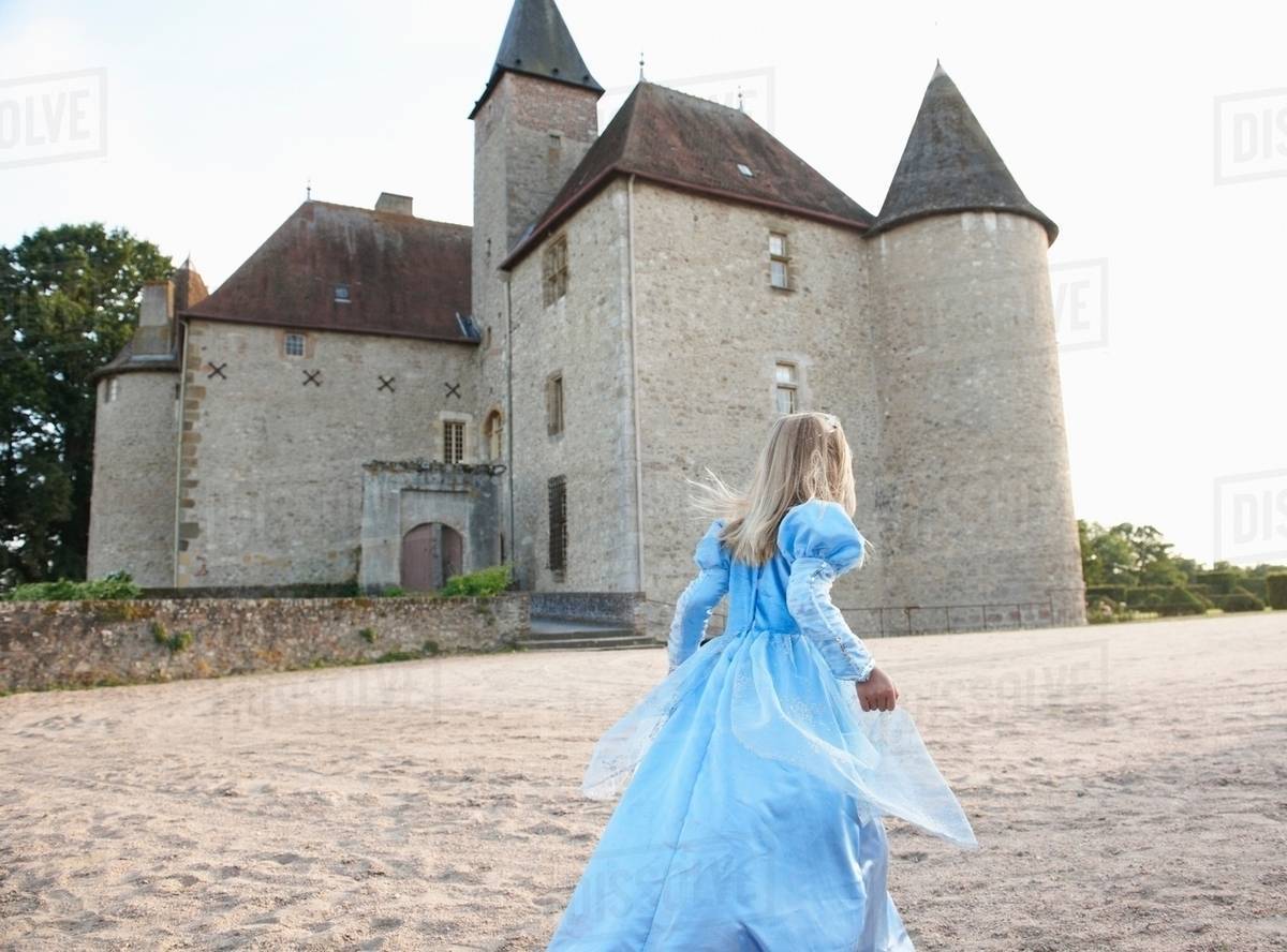Girl as a princess infront of castle - Stock Photo - Dissolve