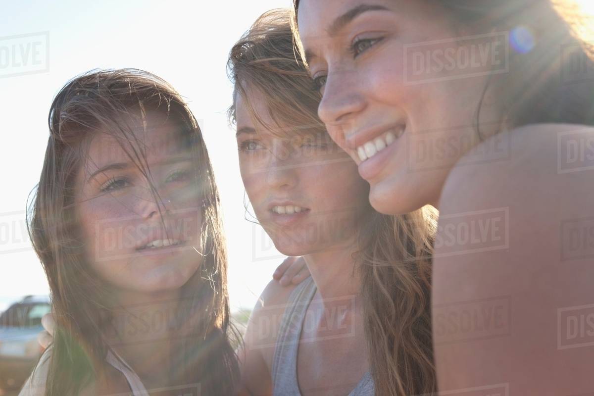 Three girls smiling - Royalty-free Stock Photo | Dissolve