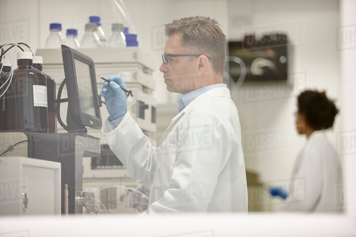 Scientists working in laboratory - Royalty-free Stock Photo | Dissolve