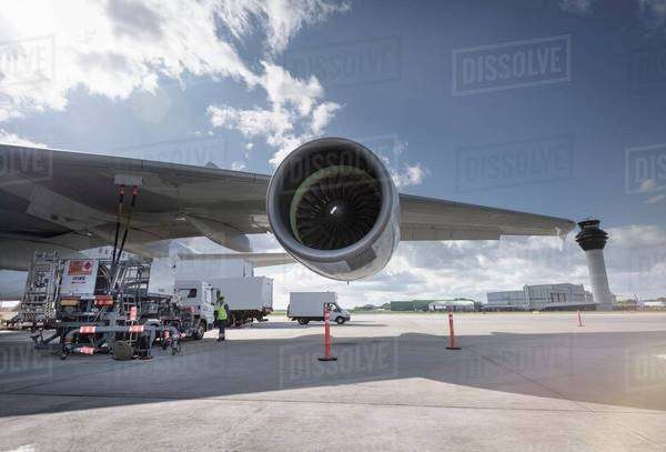 View of A380 jet engine and control tower at airport - Stock Photo ...