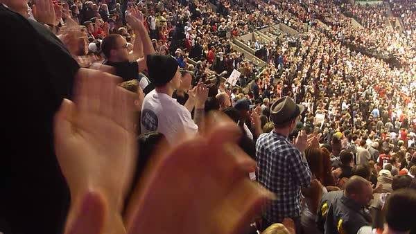 Full stadium crowd on their feet cheering and clapping loud after home ...