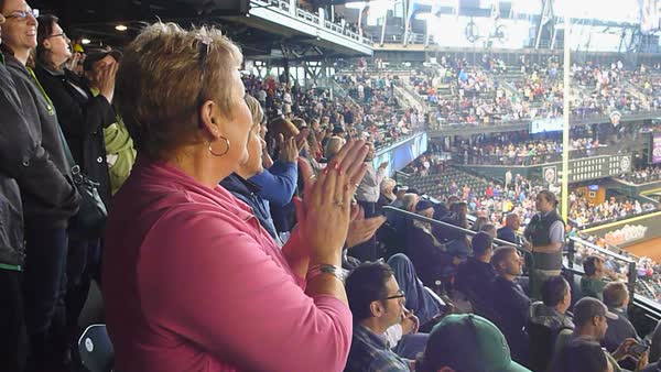 Baseball fans standing and clapping during Seattle Mariners vs New York ...