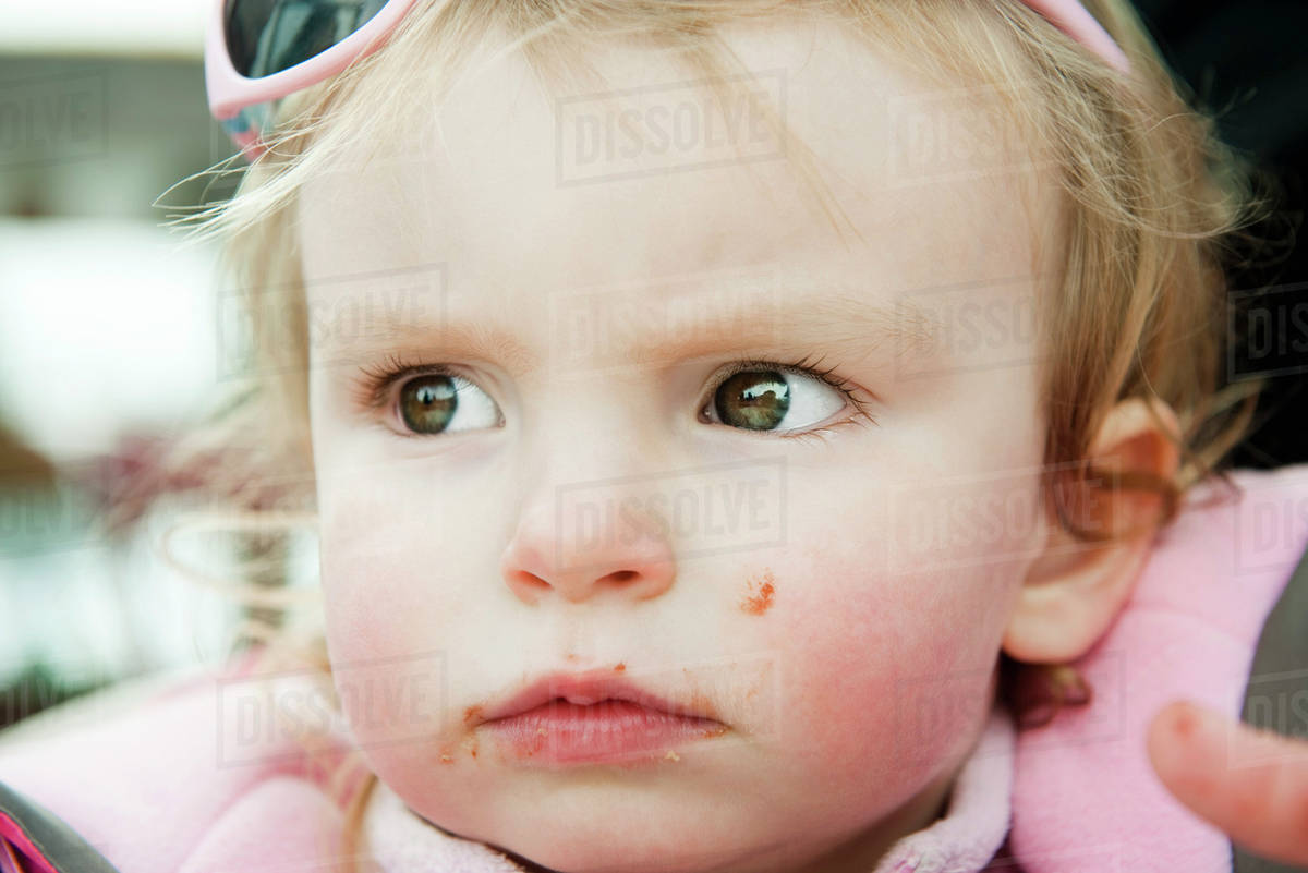 Baby girl with messy face, portrait - Royalty-free Stock Photo | Dissolve