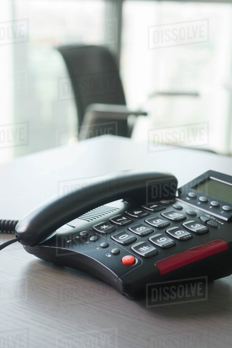 Landline phone on desk - Royalty-free Stock Photo | Dissolve