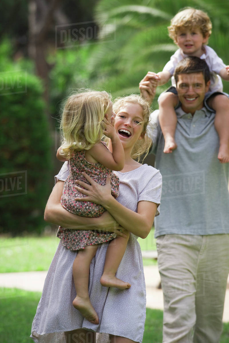 Parents carrying children outdoors - Royalty-free Stock Photo | Dissolve