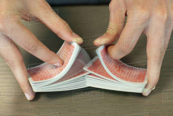 Hands shuffling cards - Royalty-free Stock Photo | Dissolve
