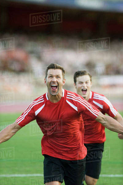 Soccer players shouting in victory - Royalty-free Stock Photo | Dissolve