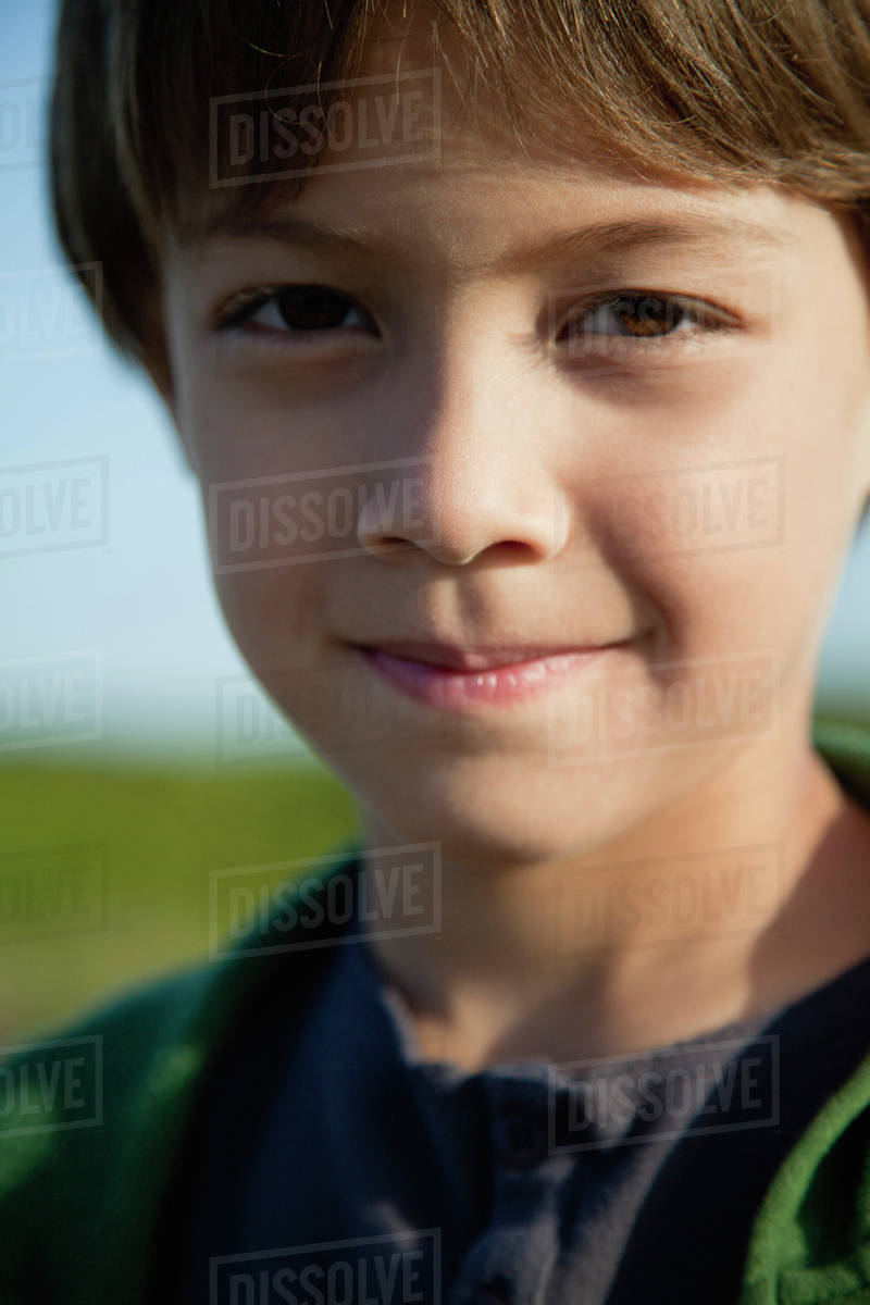 Boy smiling, portrait - Royalty-free Stock Photo | Dissolve