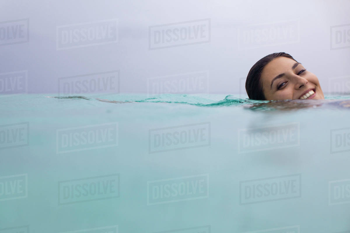 Woman swimming, portrait - Royalty-free Stock Photo | Dissolve