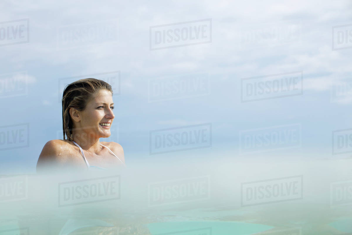 Woman relaxing in water - Stock Photo - Dissolve
