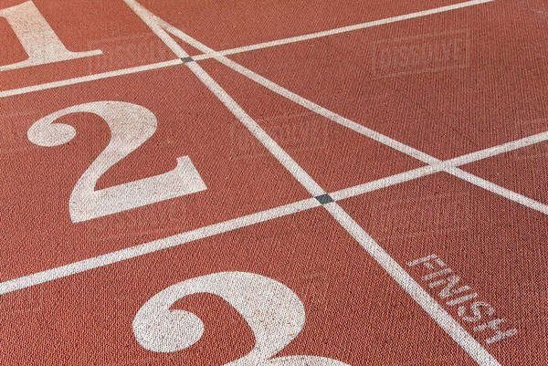 Lanes of running track, focus on lane two - Stock Photo - Dissolve