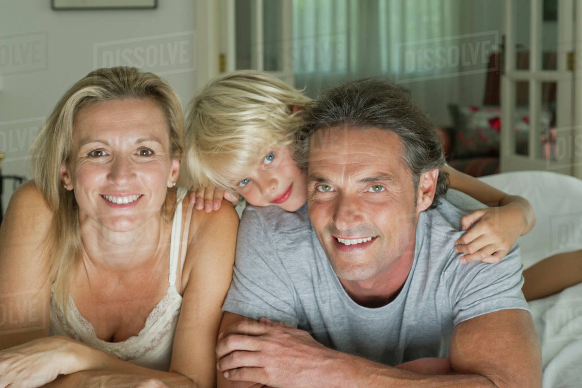Family with one child, portrait - Stock Photo - Dissolve
