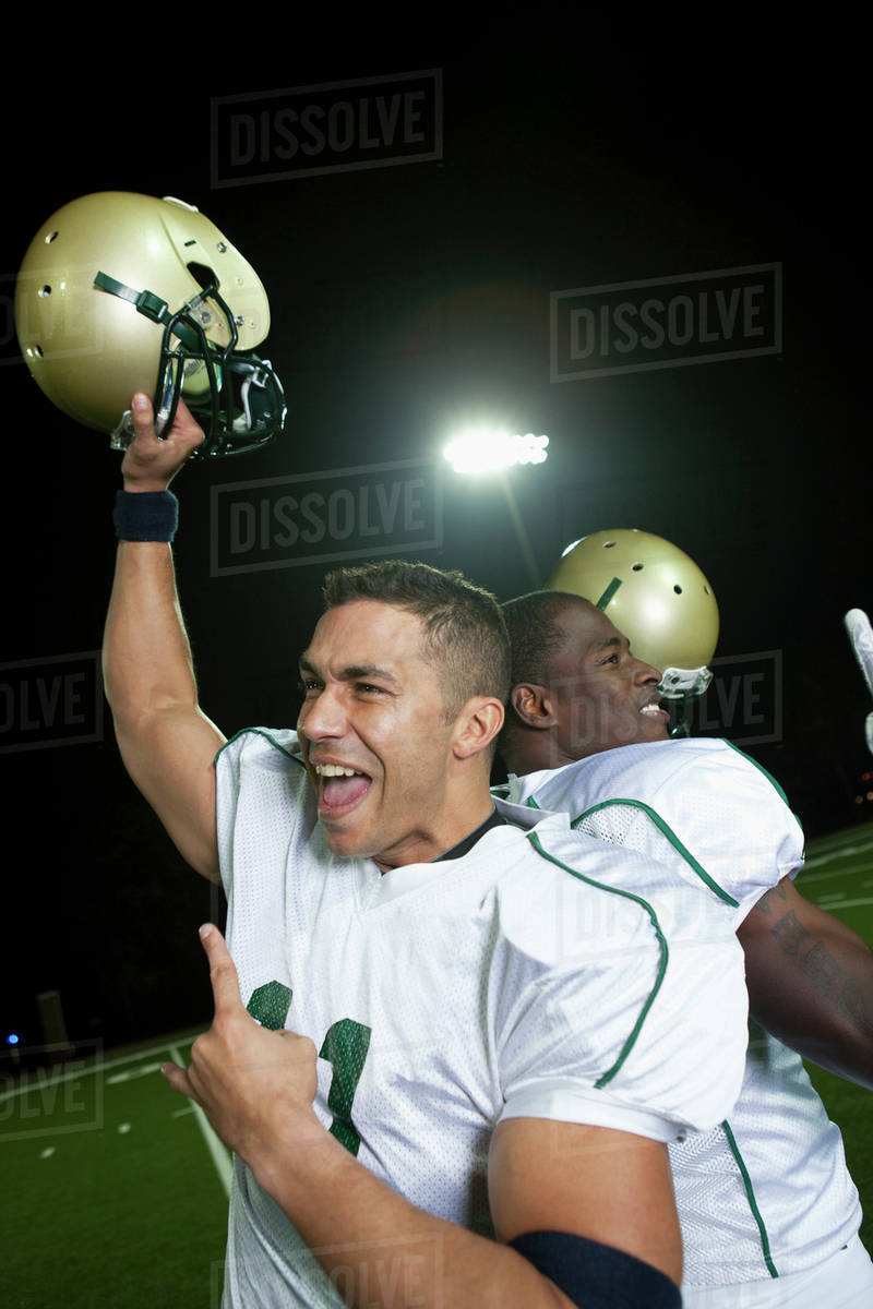 Football players celebrating victory - Royalty-free Stock Photo | Dissolve