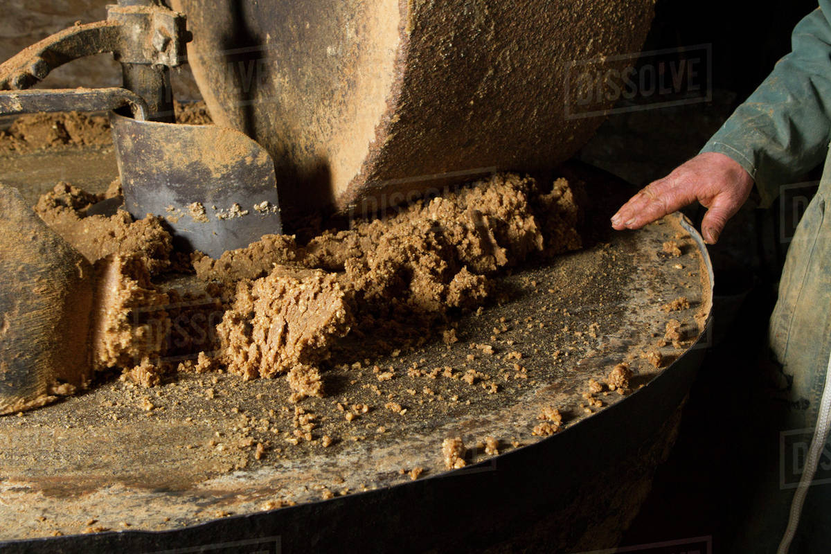 Milling machine grinding walnuts - Stock Photo - Dissolve