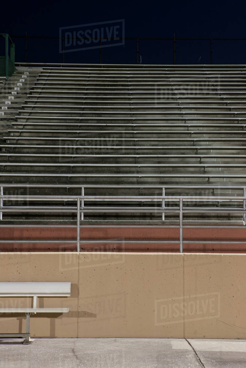 Empty bleachers at night - Royalty-free Stock Photo | Dissolve