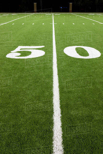 Fifty yard line on football field - Stock Photo - Dissolve