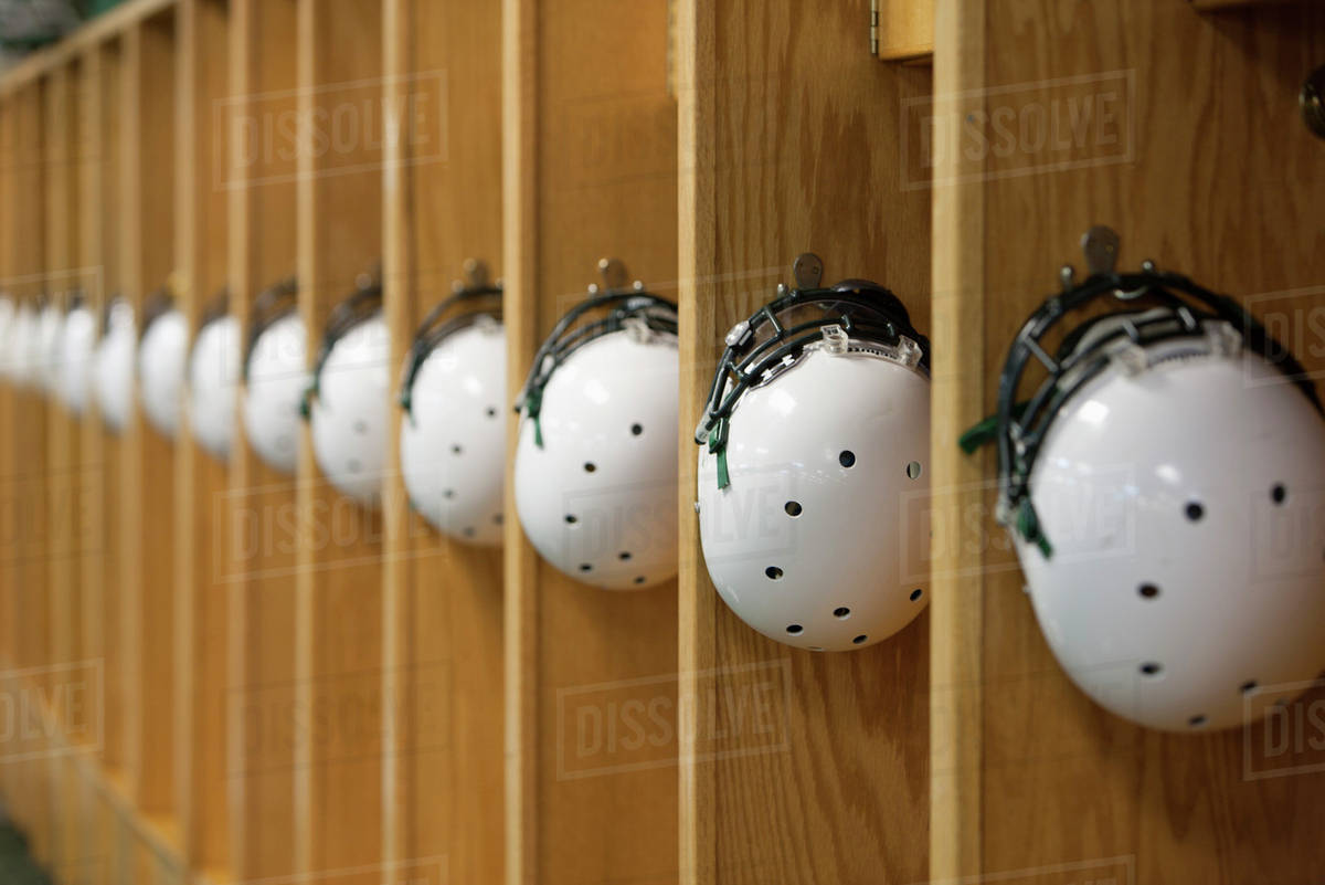 Helmets hanging in locker room - Royalty-free Stock Photo | Dissolve