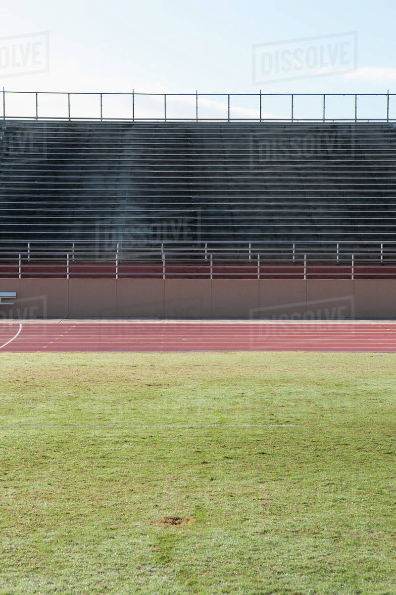 Empty stadium and running track - Stock Photo - Dissolve