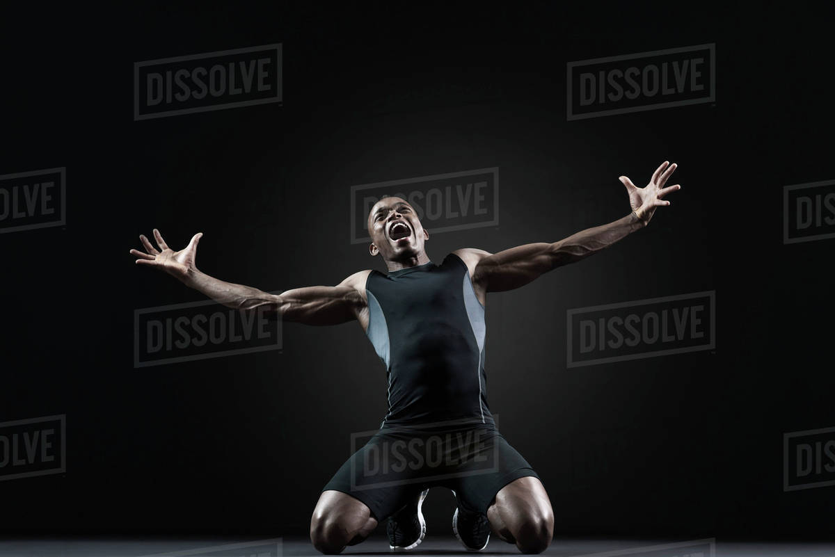 Male athlete kneeling and shouting with despair - Royalty-free Stock ...