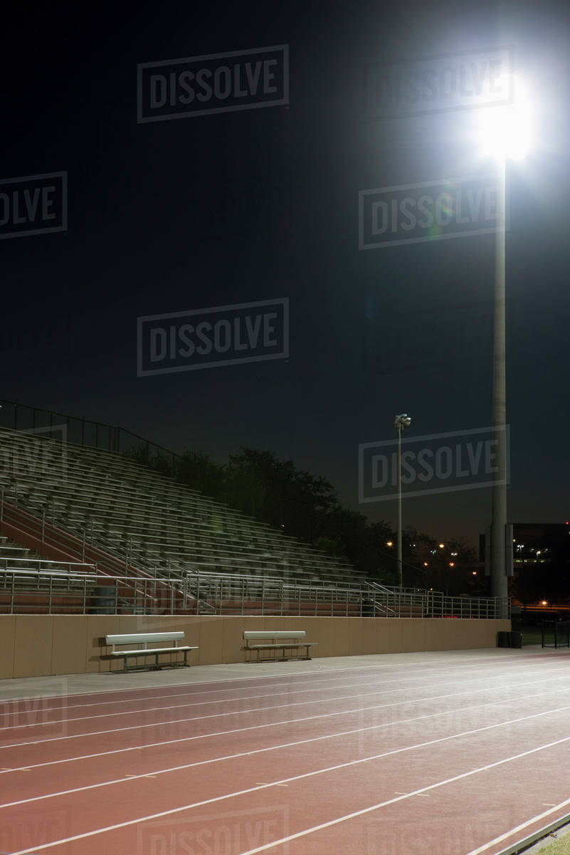Running track at night - Royalty-free Stock Photo | Dissolve