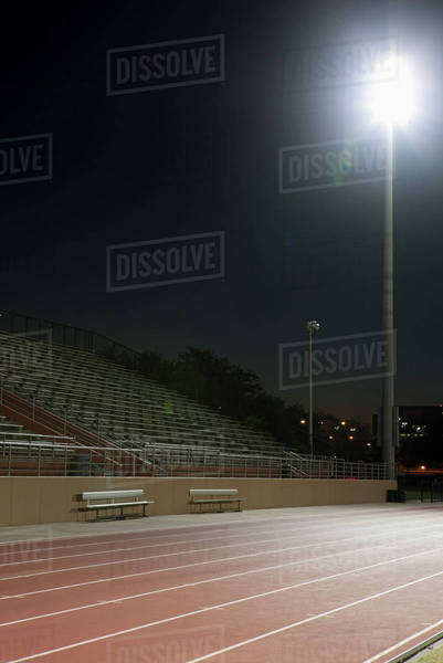 Running track at night - Royalty-free Stock Photo | Dissolve