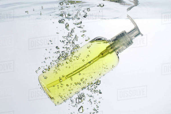 Soap dispenser submerged in water - Royalty-free Stock Photo | Dissolve