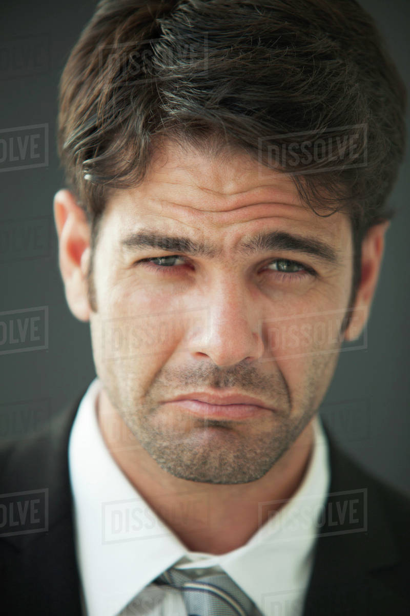 Man with sad expression, portrait - Royalty-free Stock Photo | Dissolve