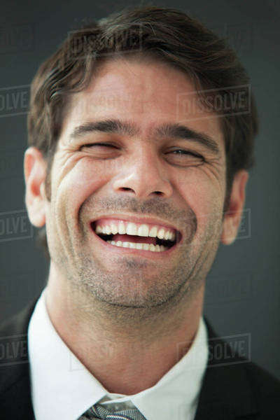 Man bursting out laughing, portrait - Stock Photo - Dissolve