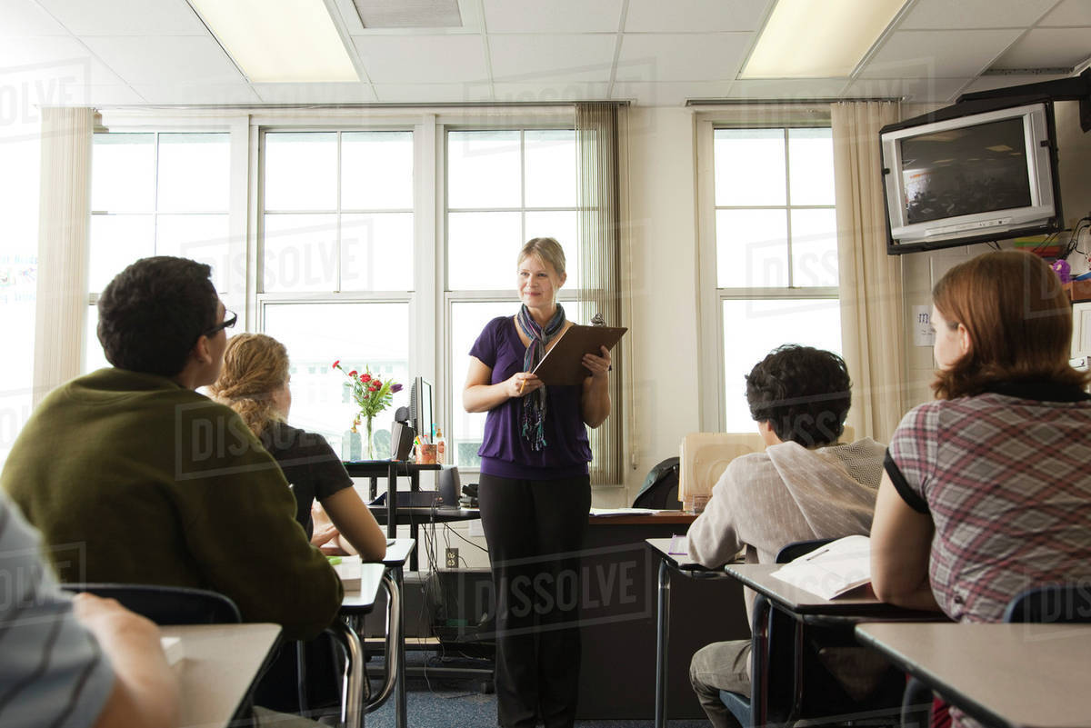 High school teacher addressing her class - Royalty-free Stock Photo ...